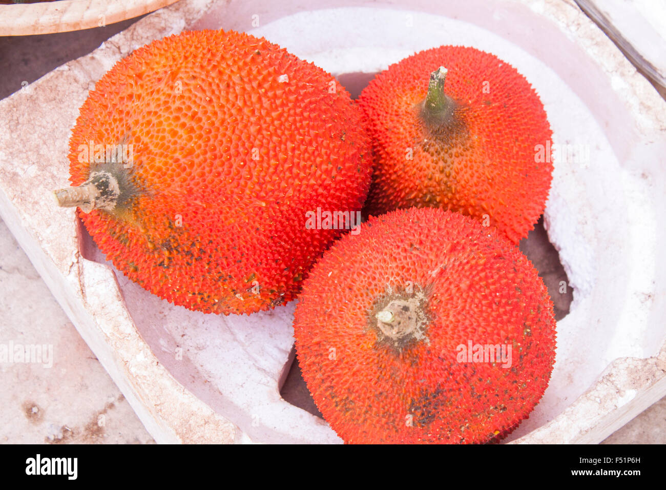 A few red gourd or gac fruits, at a market Stock Photo - Alamy