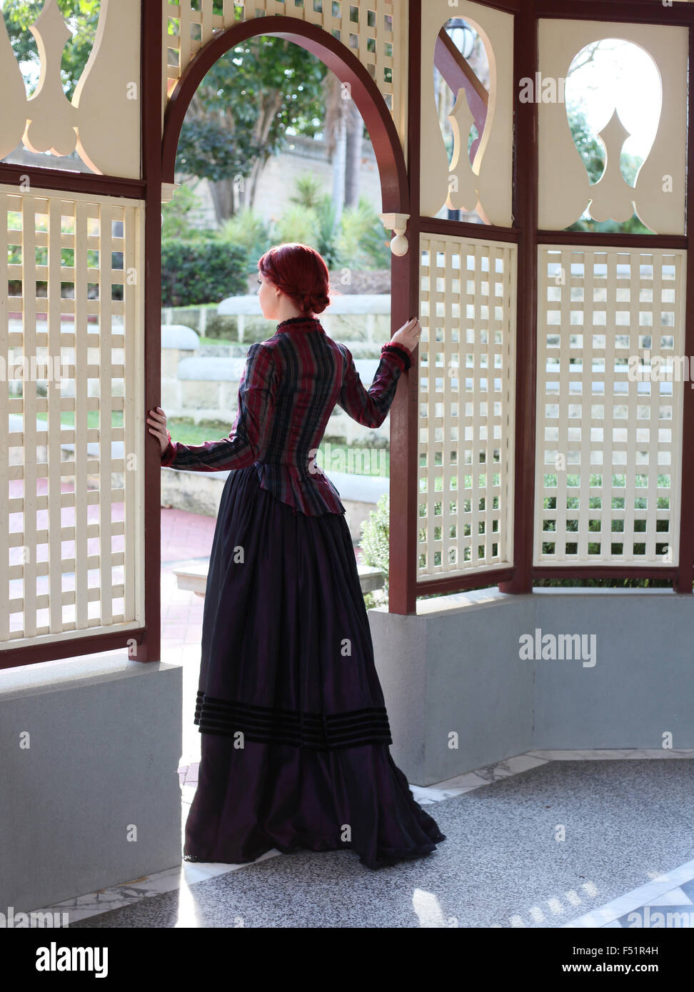 portrait of a beautiful red haired girl wearing Gothic inspired ...