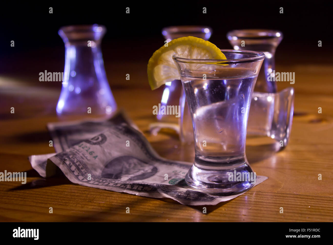 Full glass with a slice of lemon Stock Photo - Alamy