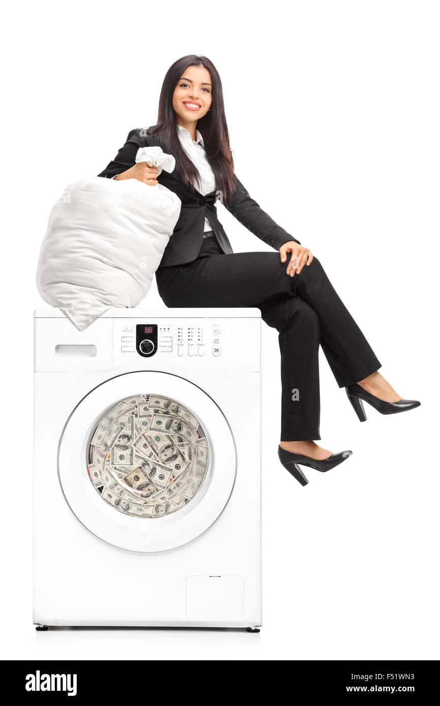 Woman sitting on washing machine Cut Out Stock Images & Pictures - Alamy