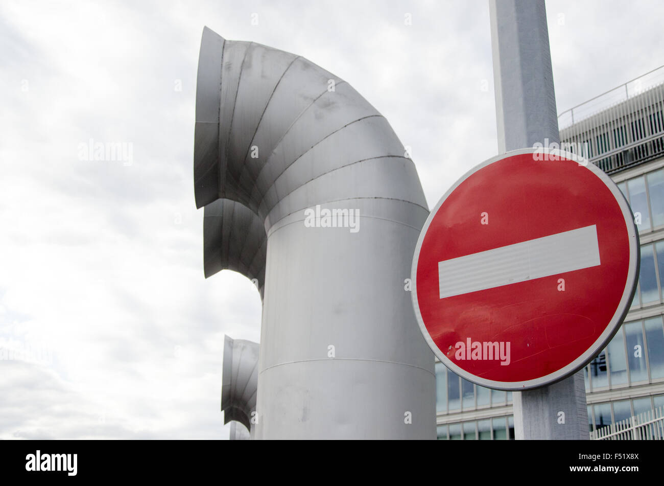 No-entry mark signs with urban architecture Stock Photo - Alamy