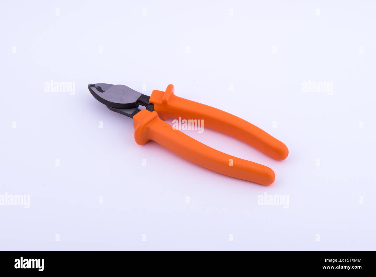 side cutter with orange plastic on white background Stock Photo - Alamy