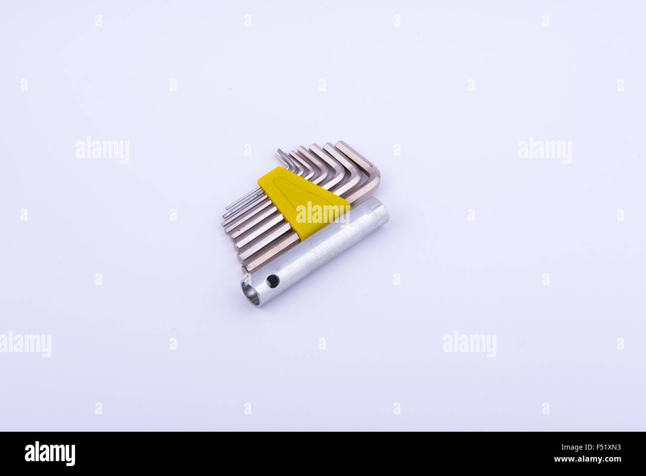 allen keys in yellow clamp on white background Stock Photo - Alamy