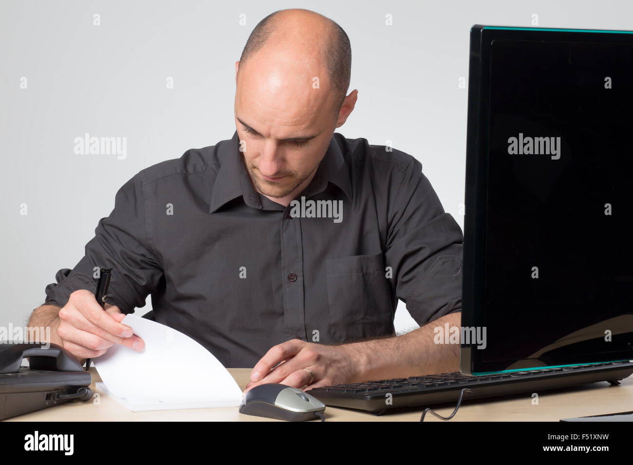 Checking the notes Stock Photo - Alamy