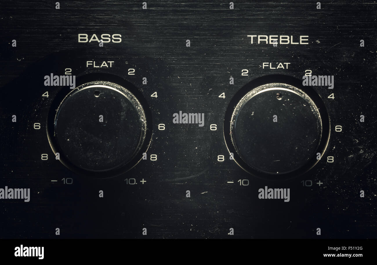 Two buttons closeup view, bass and treble control Stock Photo - Alamy