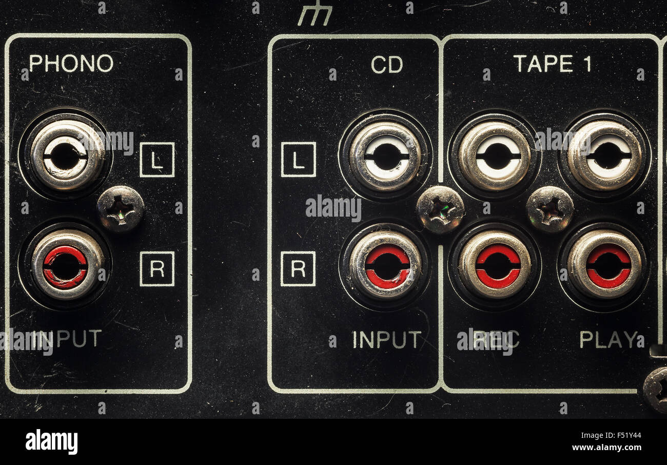 Closeup view on a rear side of an old amplifier, inputs for tape, phono ...