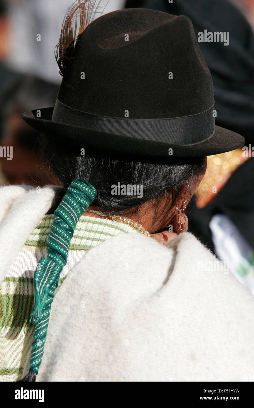 Indigenous woman wearing traditional hat at Otavalo market, Ecuador ...