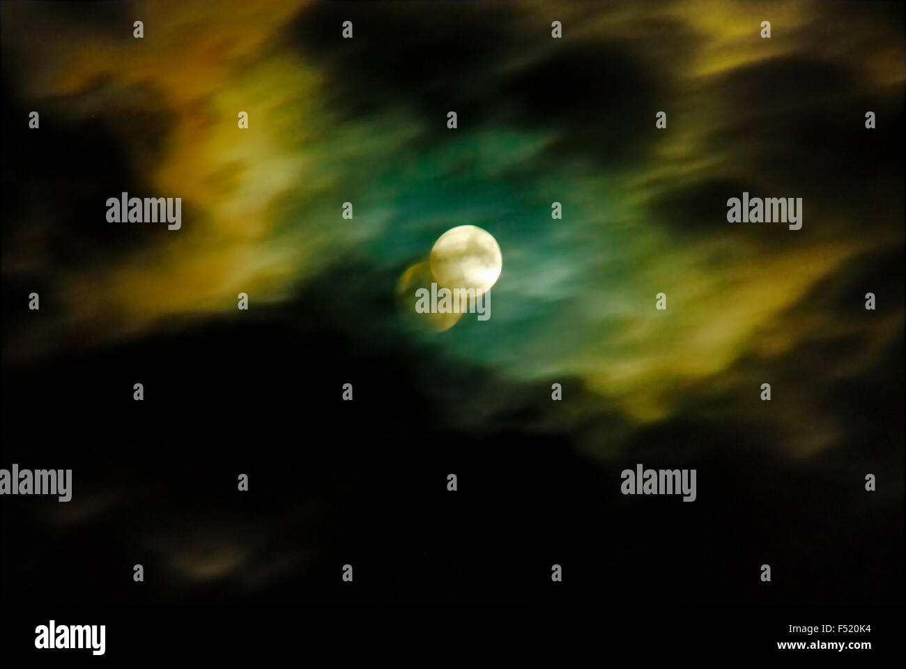 Two moons in the cloudy sky Stock Photo - Alamy