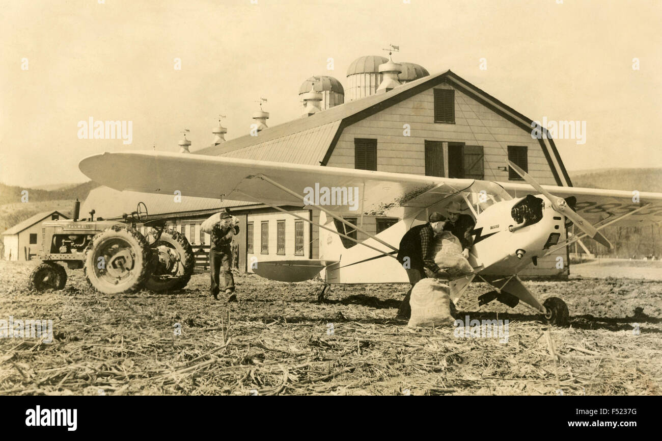 Loading fertilizers on the plane hi-res stock photography and images ...