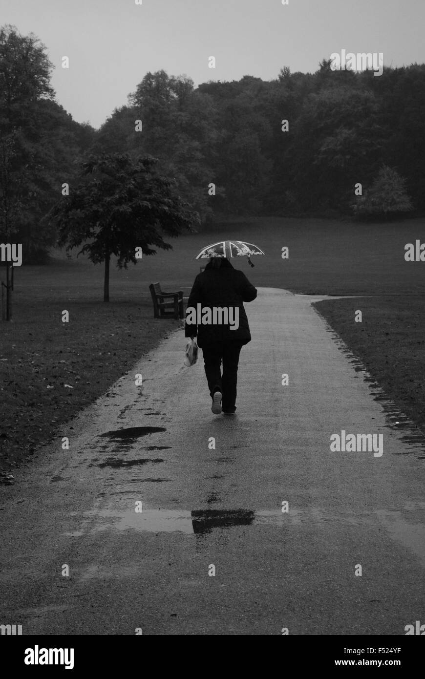 Alone in rain Black and White Stock Photos & Images - Alamy
