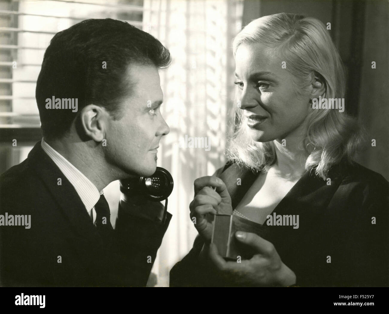 The actors Ingrid Thulin and Gunnar Hellstrom in a scene from the movie ...