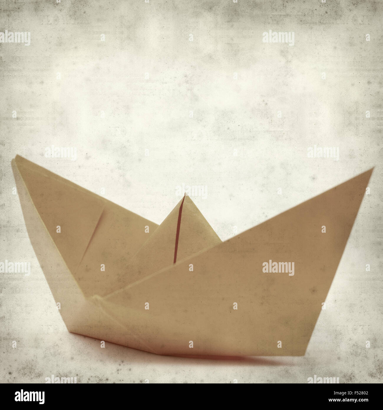 textured old paper background with origami paper boat Stock Photo - Alamy