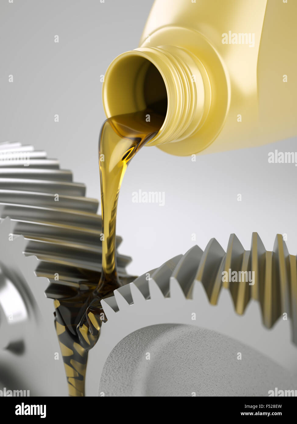 Oiling gears on grey background Stock Photo - Alamy