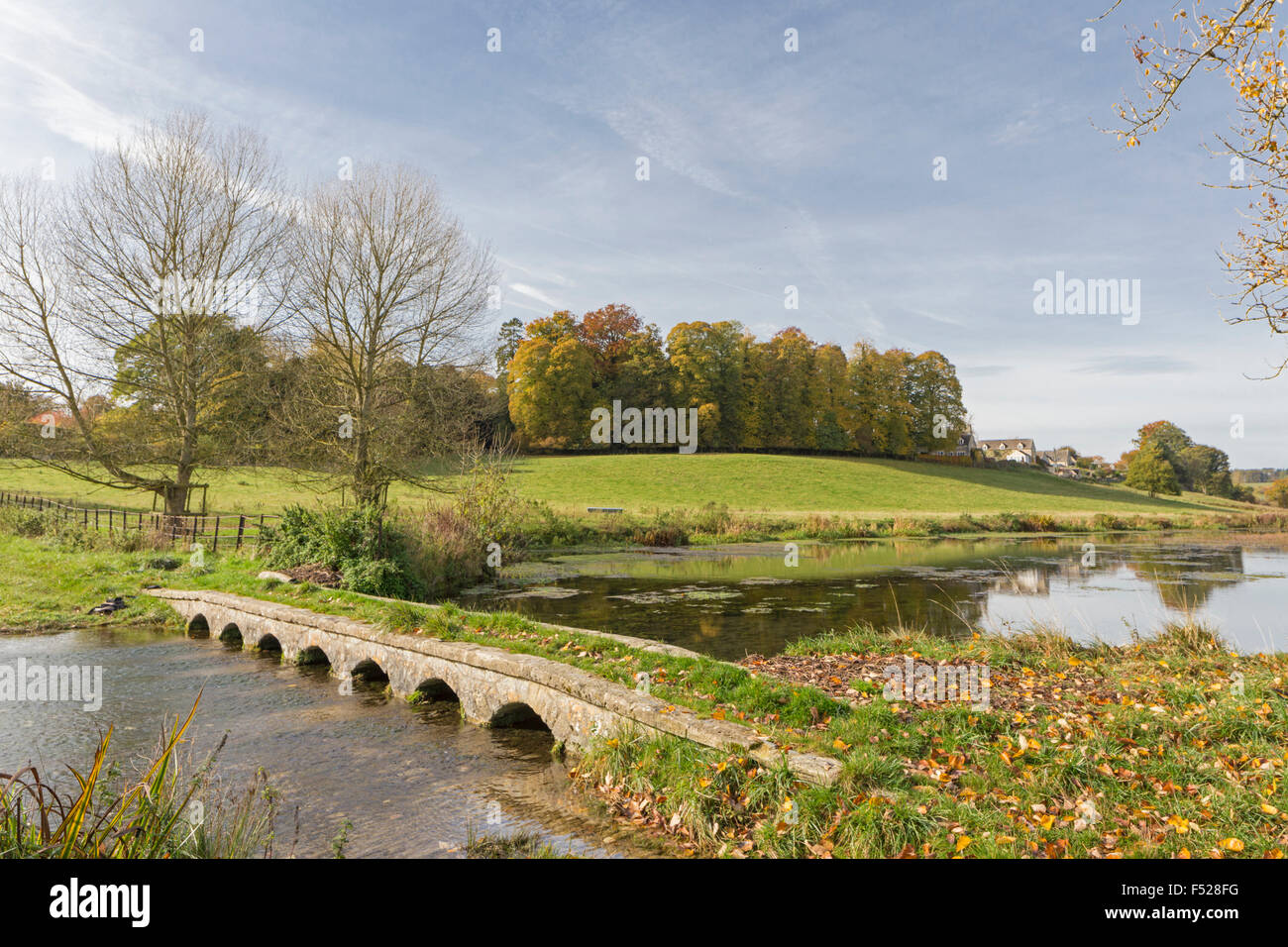 Autumn on the River Windrush near the Cotswold village of Sherbourne ...