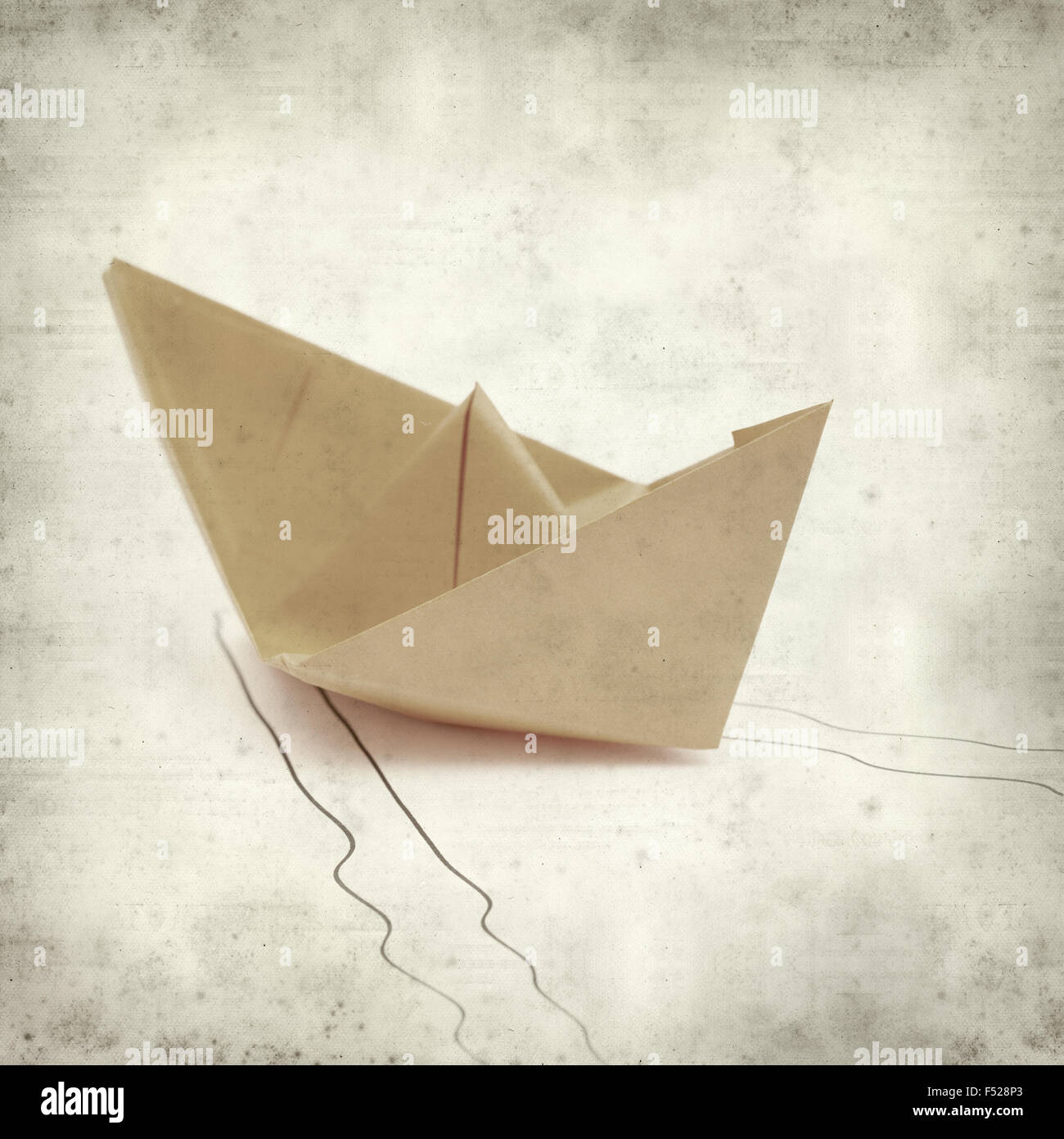 textured old paper background with origami paper boat Stock Photo - Alamy