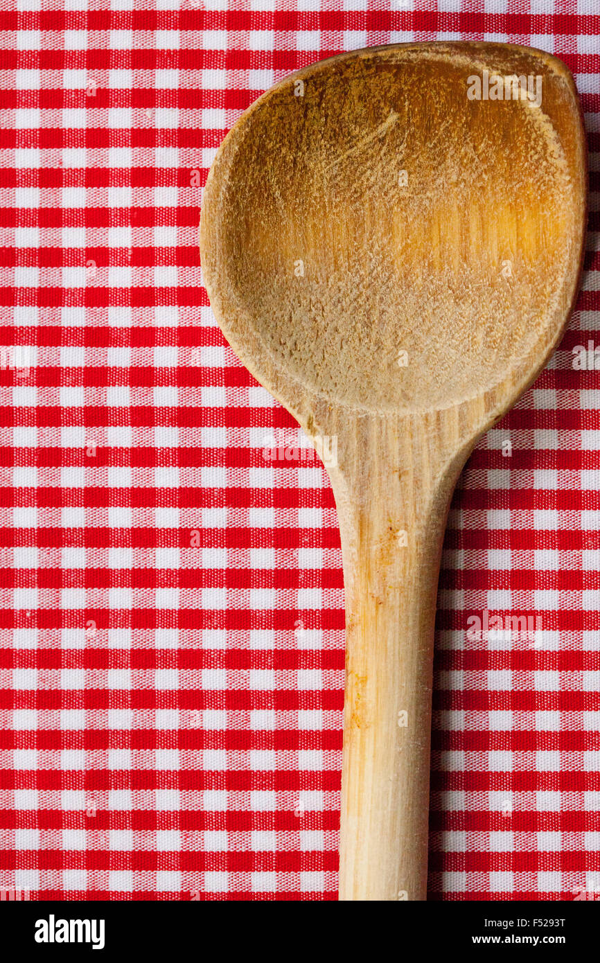 Antique wooden used spoon for cooking with red white background Stock ...