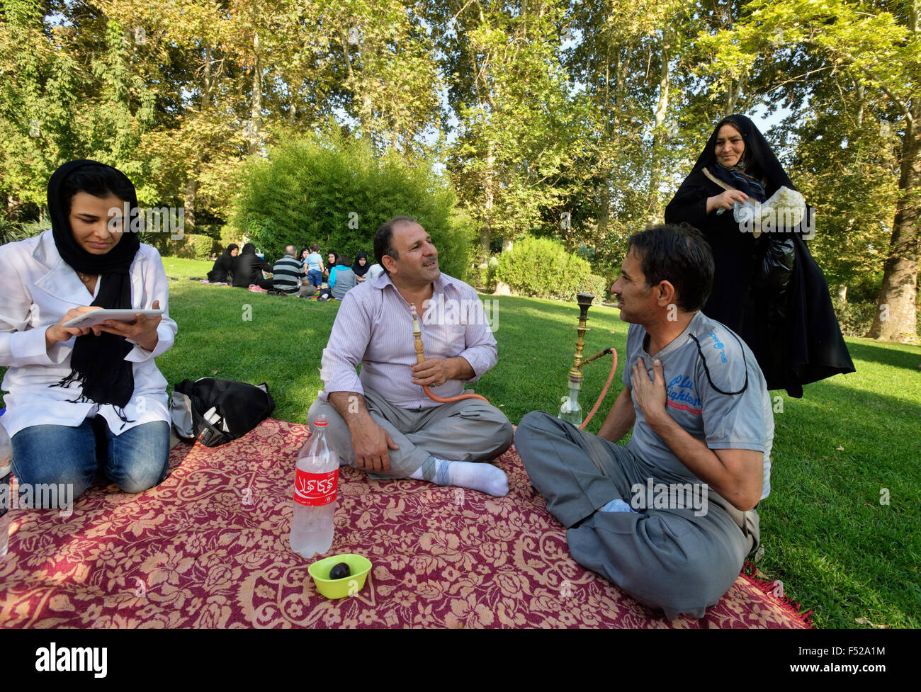 Family picnic in the park-e Laleh in Tehran on Friday, which is day off ...