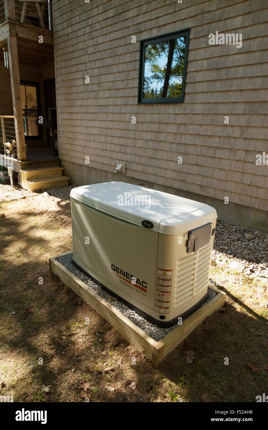 An external backup stand-by Generac generator for a domestic house, USA ...
