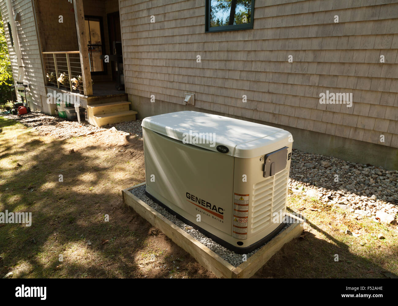 An external backup stand-by Generac generator for a domestic house, USA ...