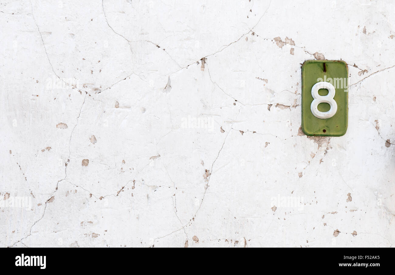 Simple White abstract wall background with house number of eight in a ...