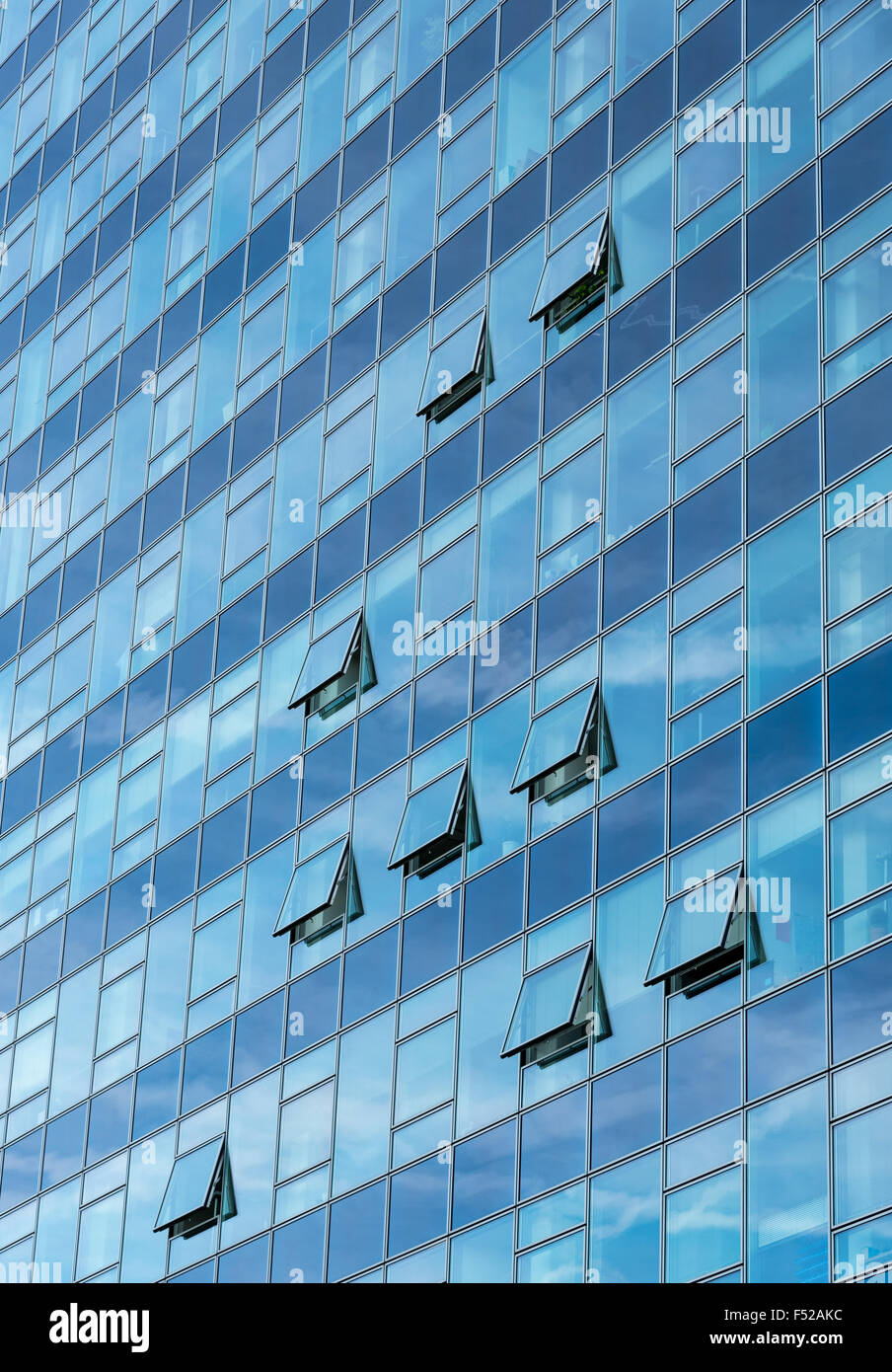 Architectural detail of a modern blue glass skyscraper building with ...