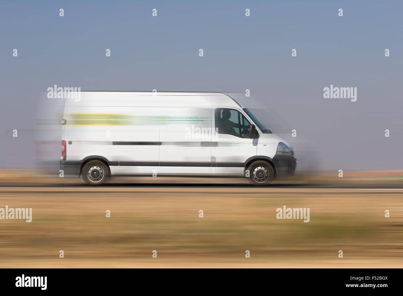 Delivery van on road Stock Photo - Alamy