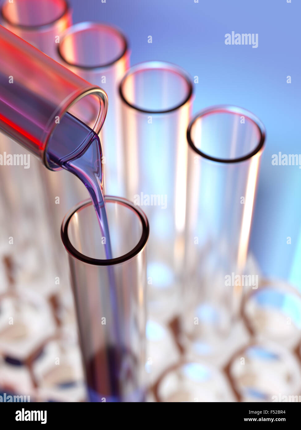 Pouring blue liquid in test-tube close up Stock Photo - Alamy