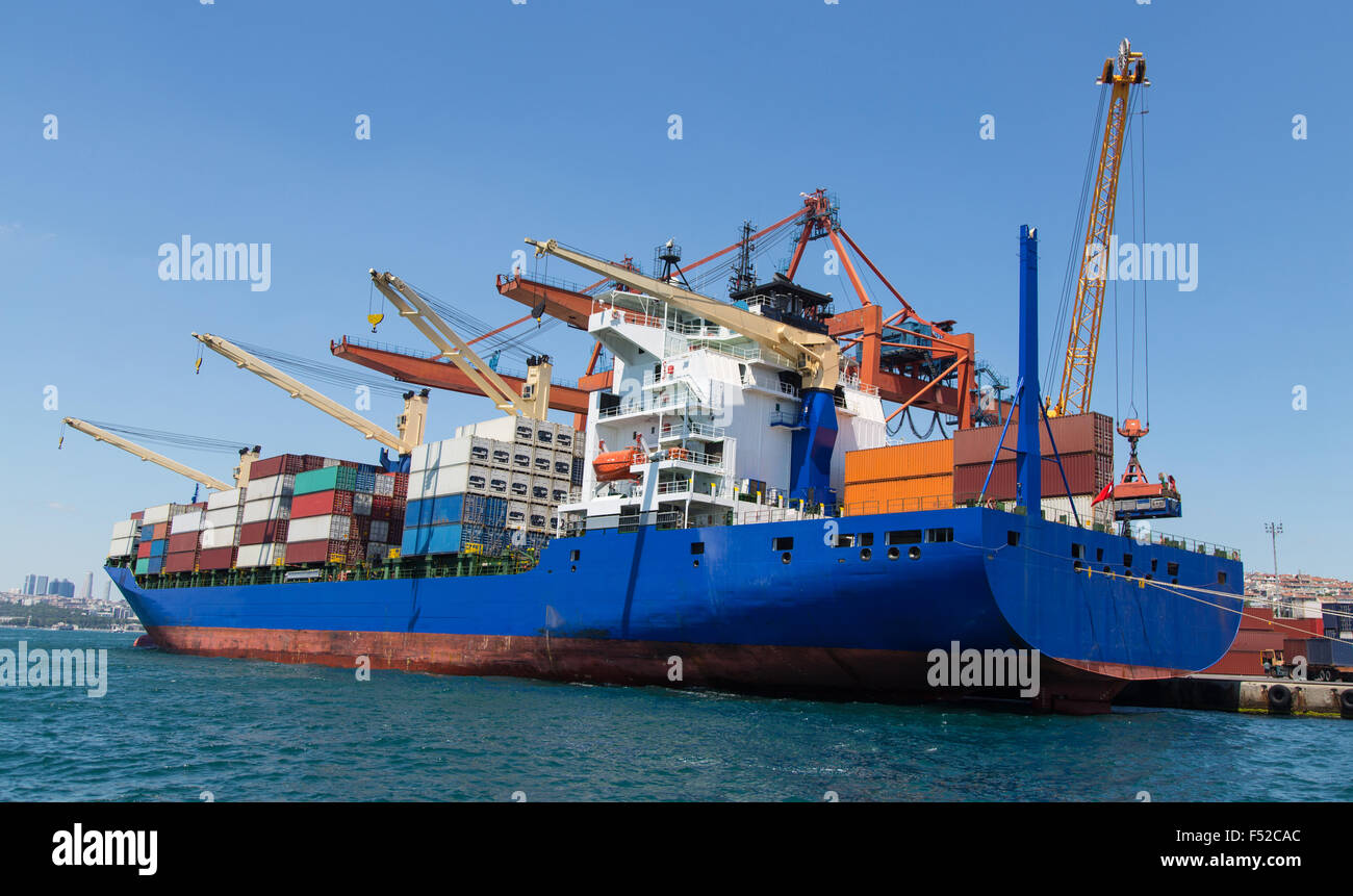 Container Ship is loading in a port Stock Photo - Alamy