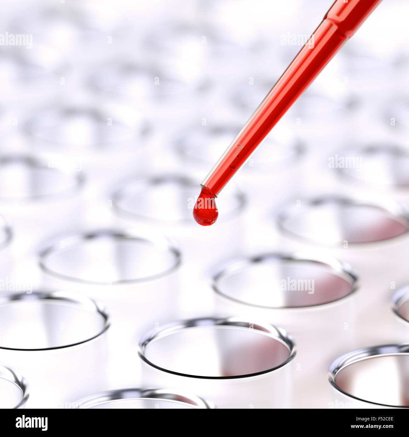 Dropping blood sample in test-tube close-up Stock Photo - Alamy