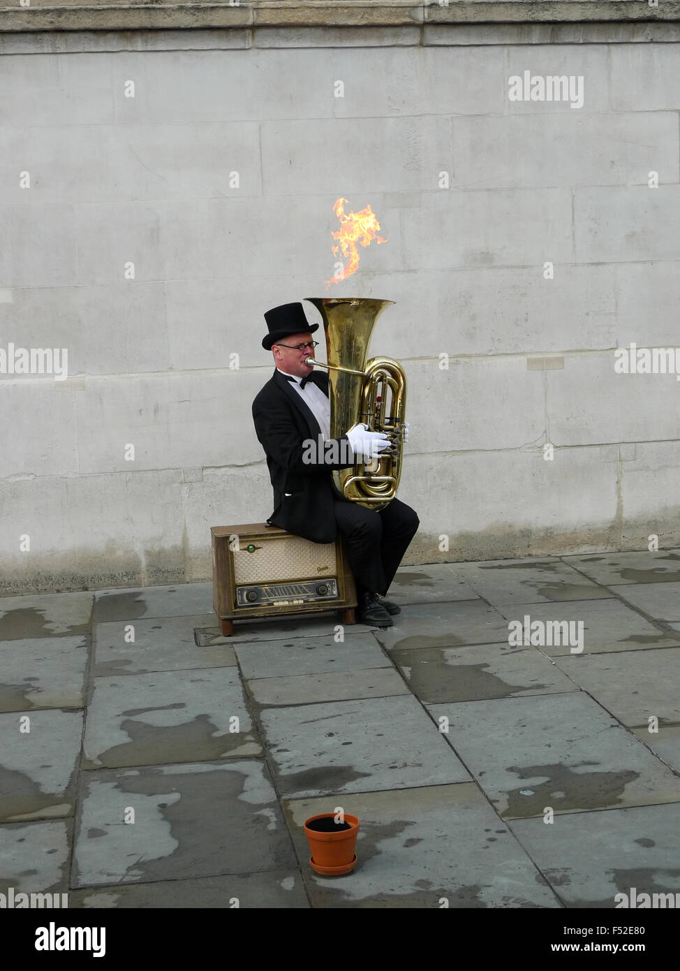 Street artist plays a 'flaming' tuba, Trafalga Square, London, England ...