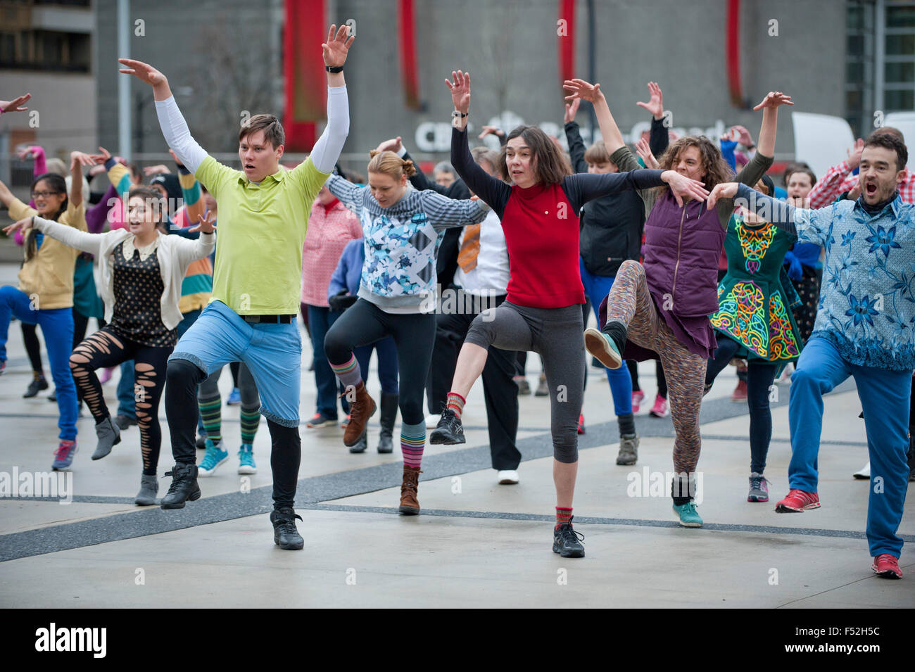 Many people dance in the Queen Elizabeth Theatre square in downtown of ...