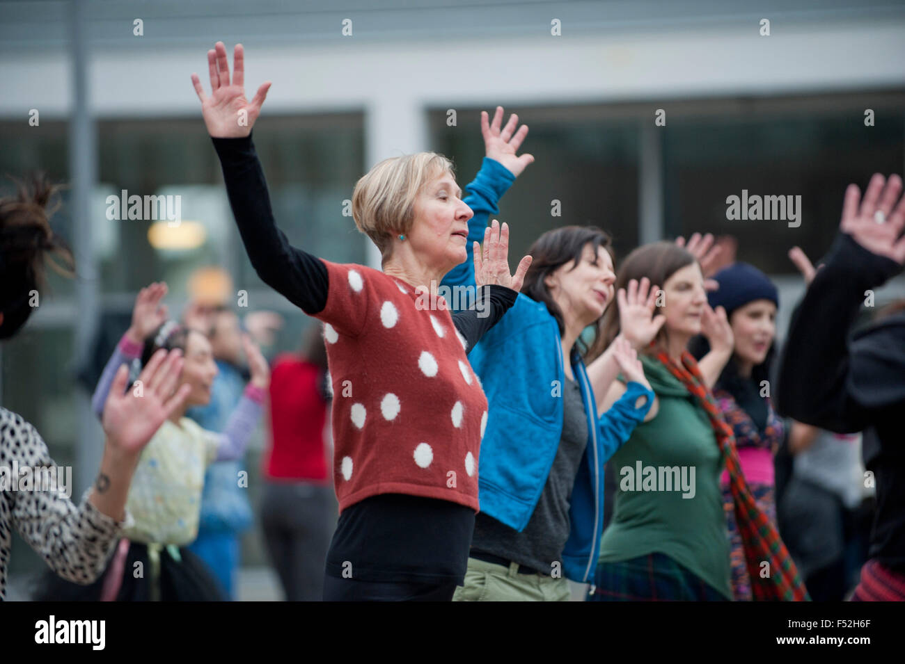 Many people dance in the Queen Elizabeth Theatre square in downtown of ...
