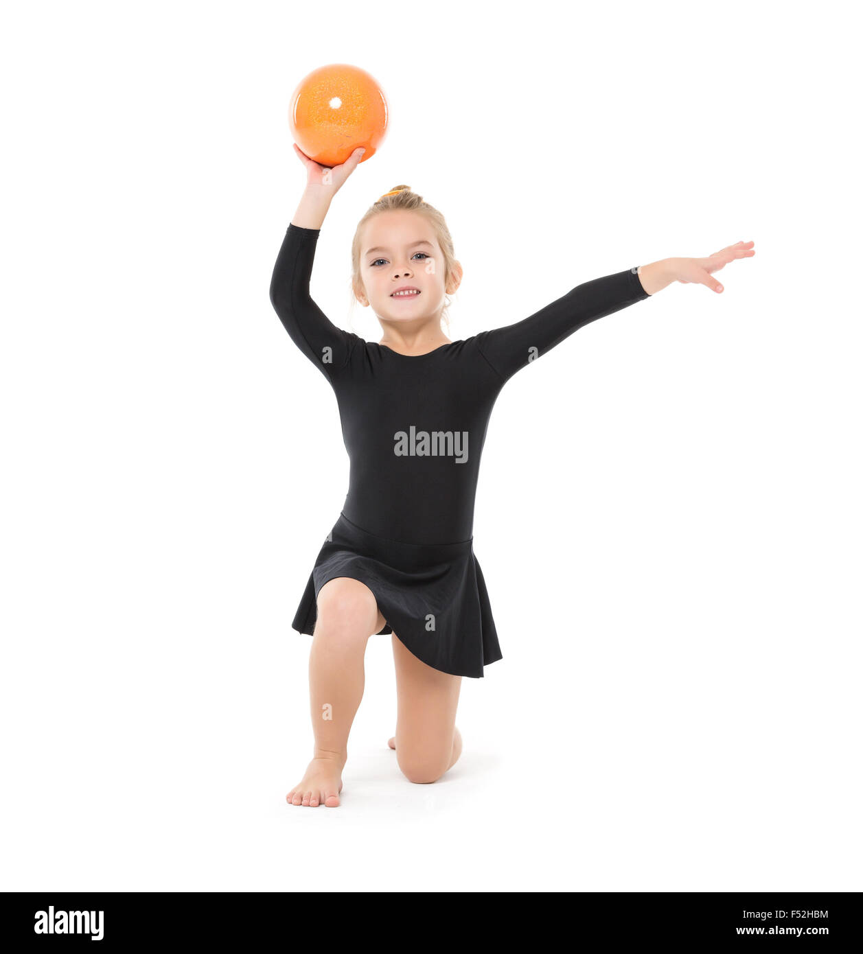 Little Gymnast Practicing with a Ball, on white background Stock Photo ...