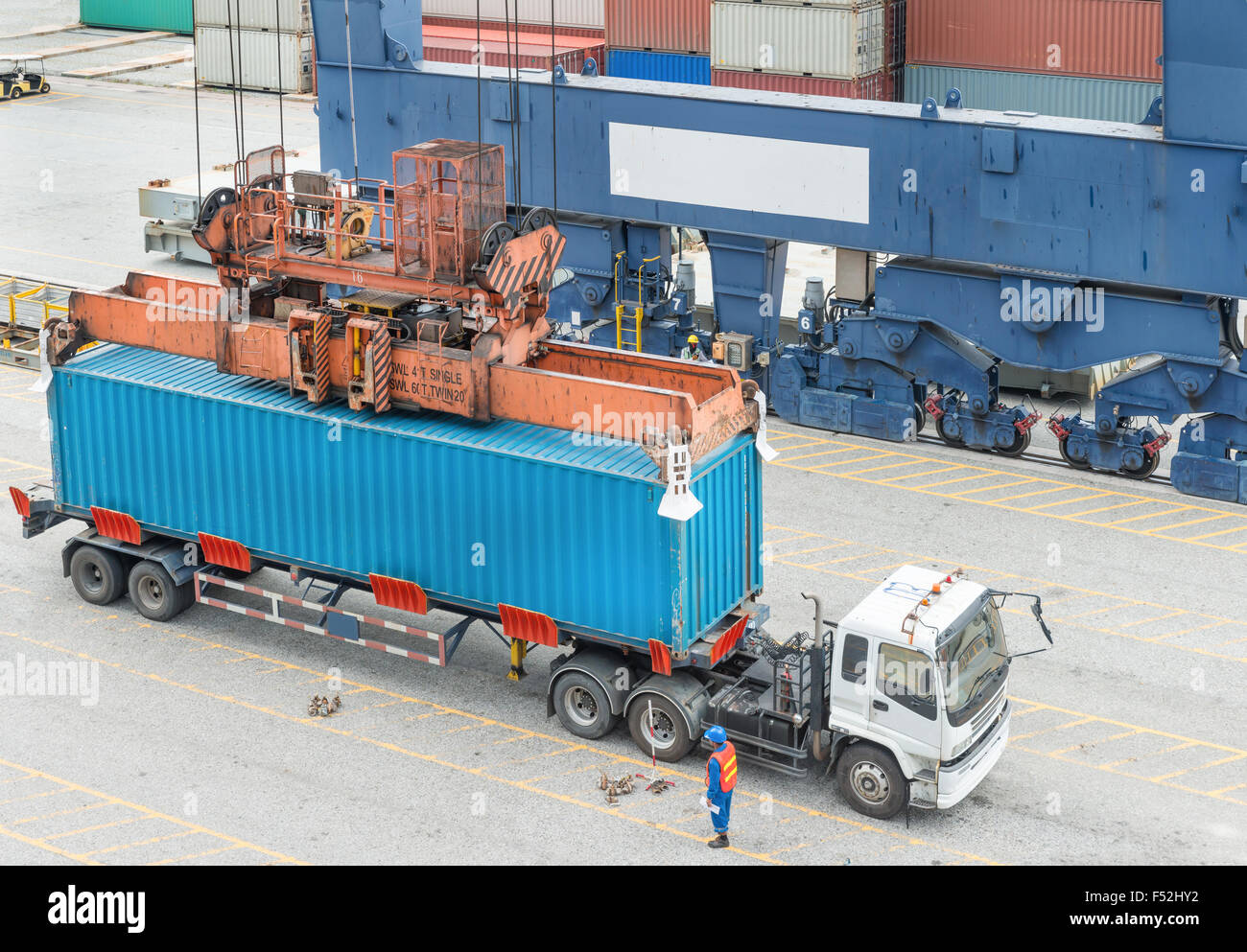Container Cargo freight ship with working crane loading bridge in ...