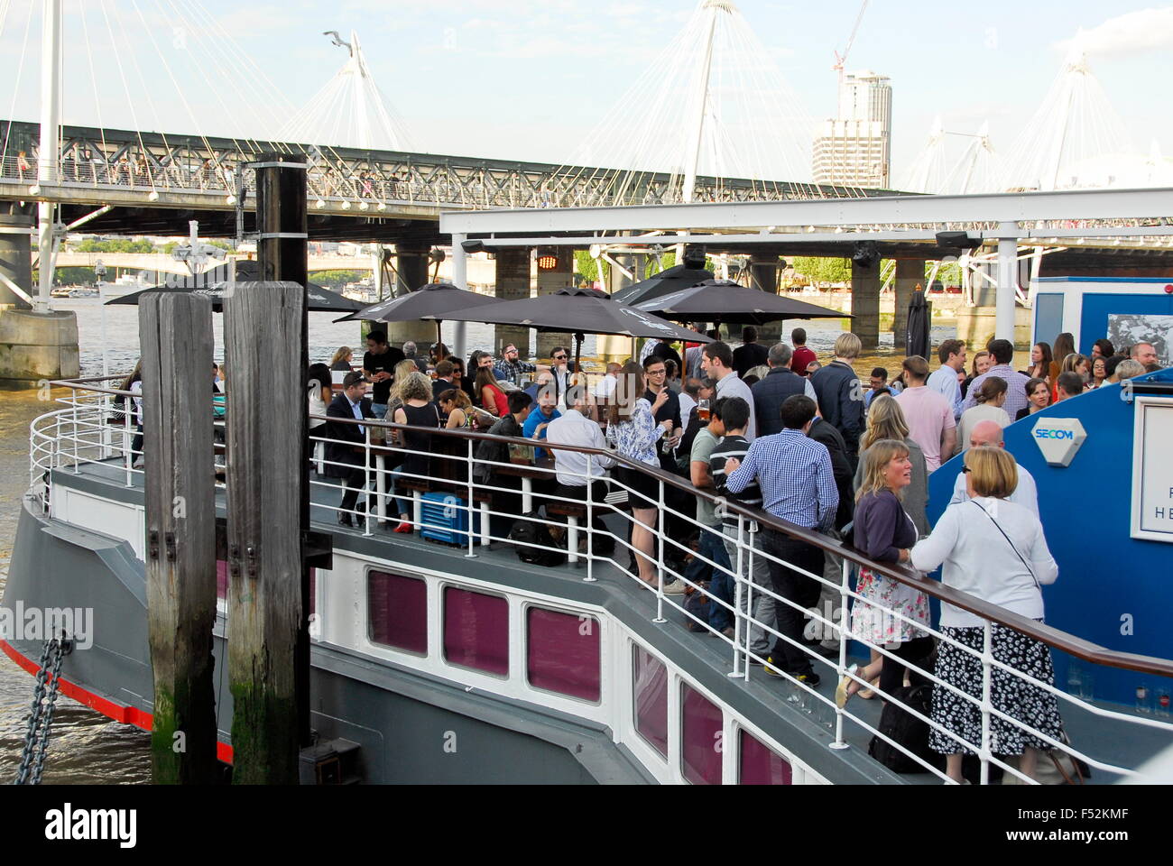 Crowd of pub drinkers on the Tattershall Castle boat on the River ...