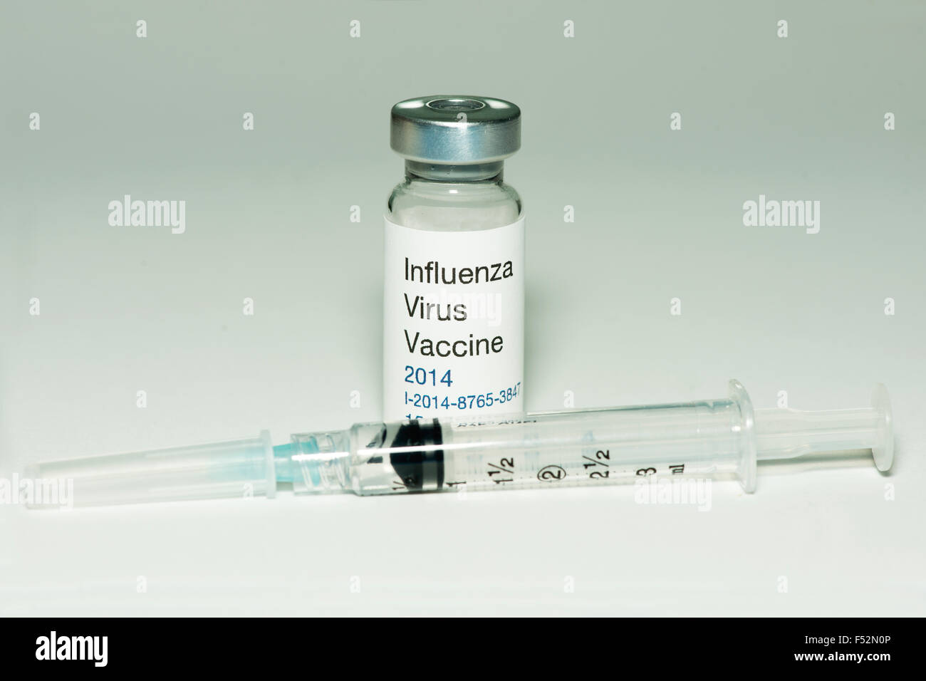 2014 Influenza flu vaccine with syringe. Label is fictitious Stock ...