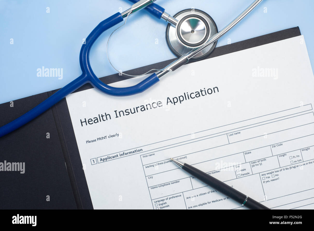 Application for health insurance with stethoscope Stock Photo - Alamy