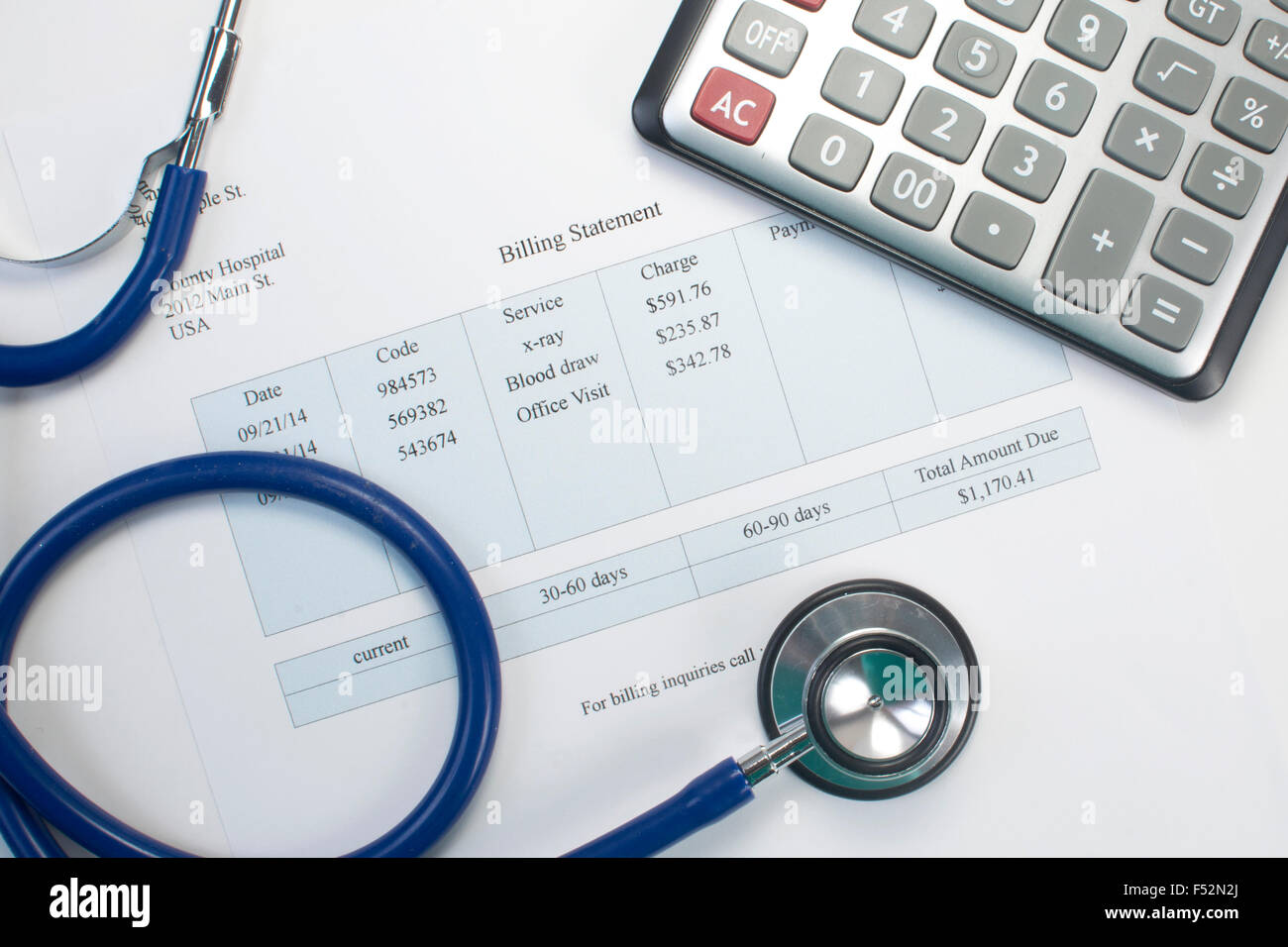 Health care billing statement with stethoscope and calculator Stock ...