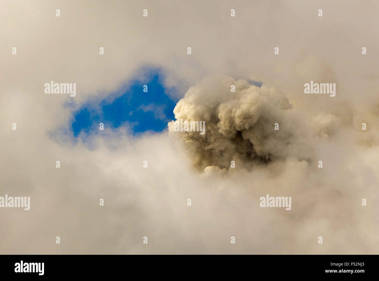 Volcanic Explosion Seen By A Cloud Window Stock Photo - Alamy