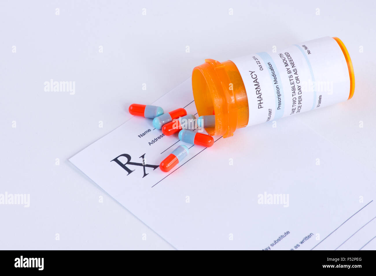 Prescription bottle and prescription on neutral background Stock Photo ...