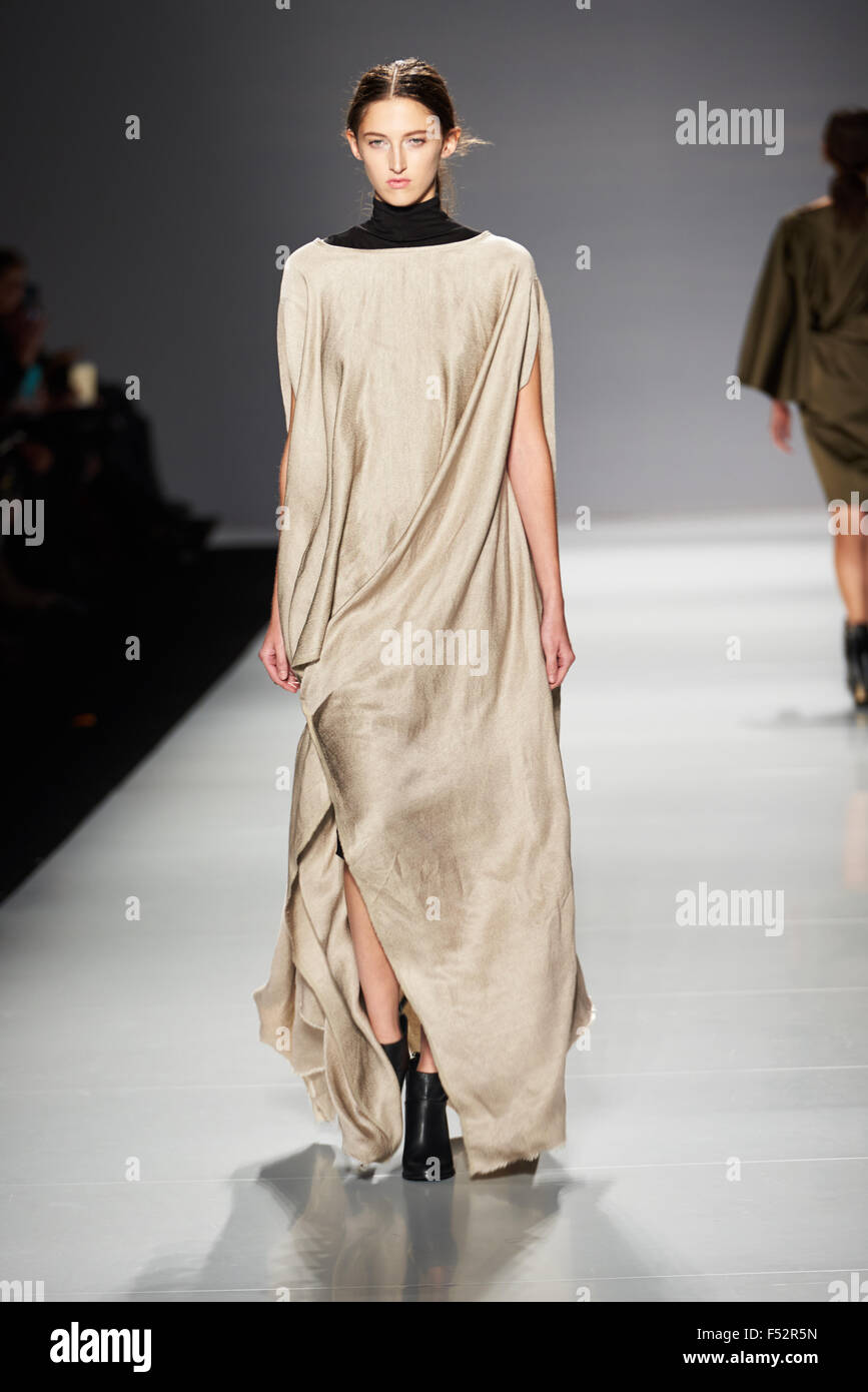 Model walking on the runway showcasing design of SID NEIGUM during ...
