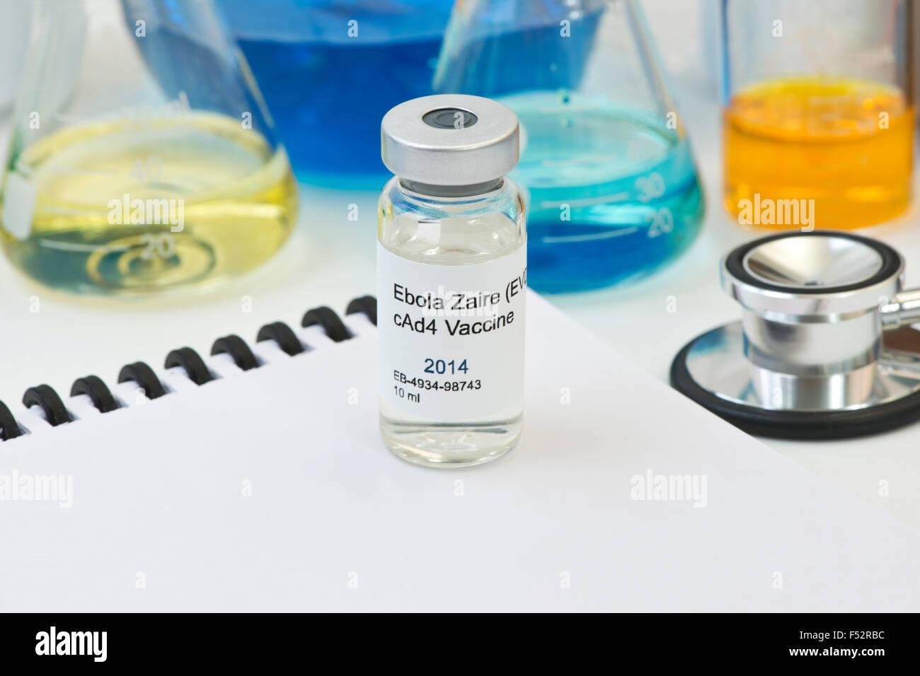 Ebola Zaire vaccine with laboratory research equipment Stock Photo - Alamy