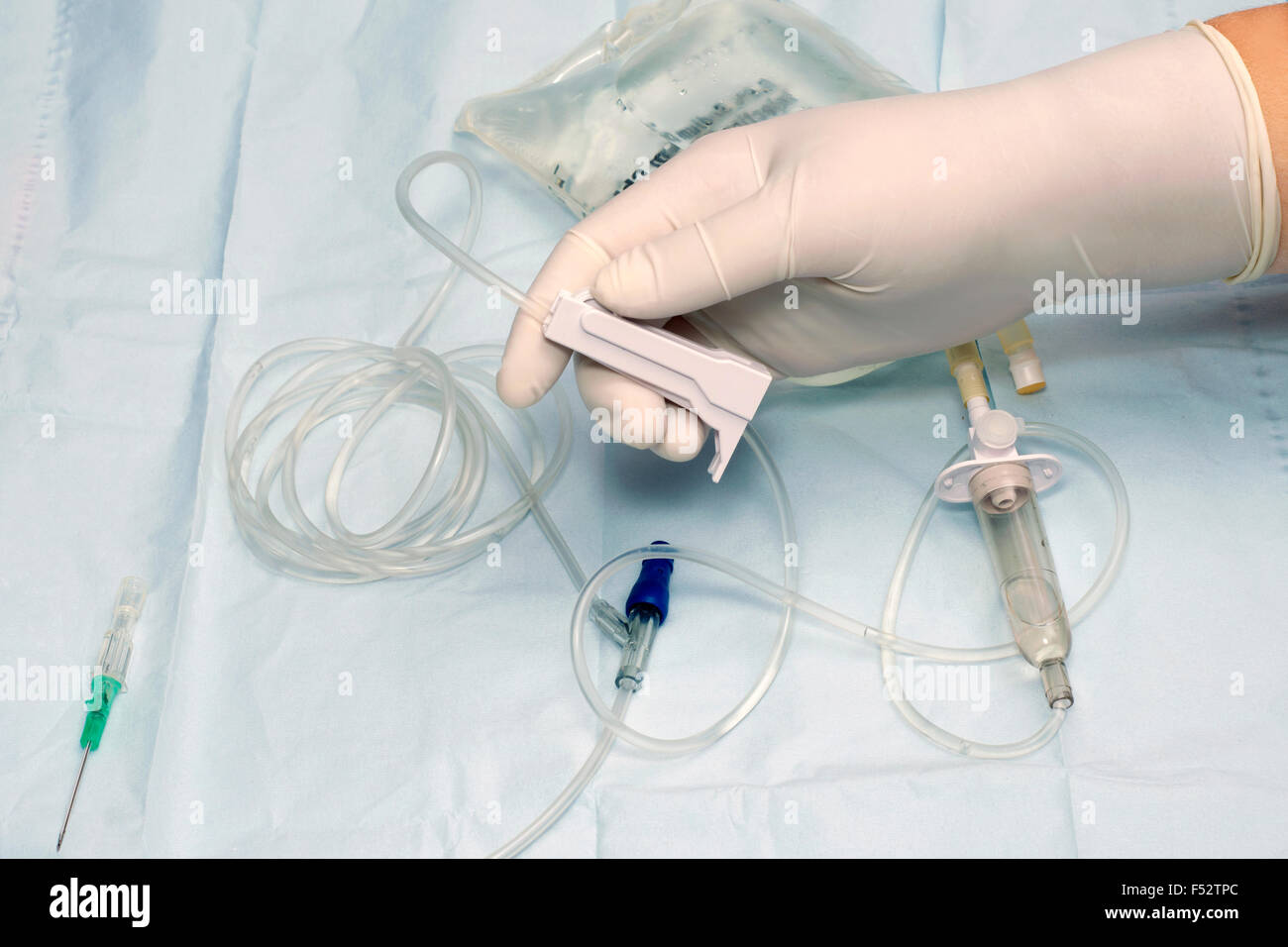 Nurse prepares IV and solution for use with patient Stock Photo - Alamy