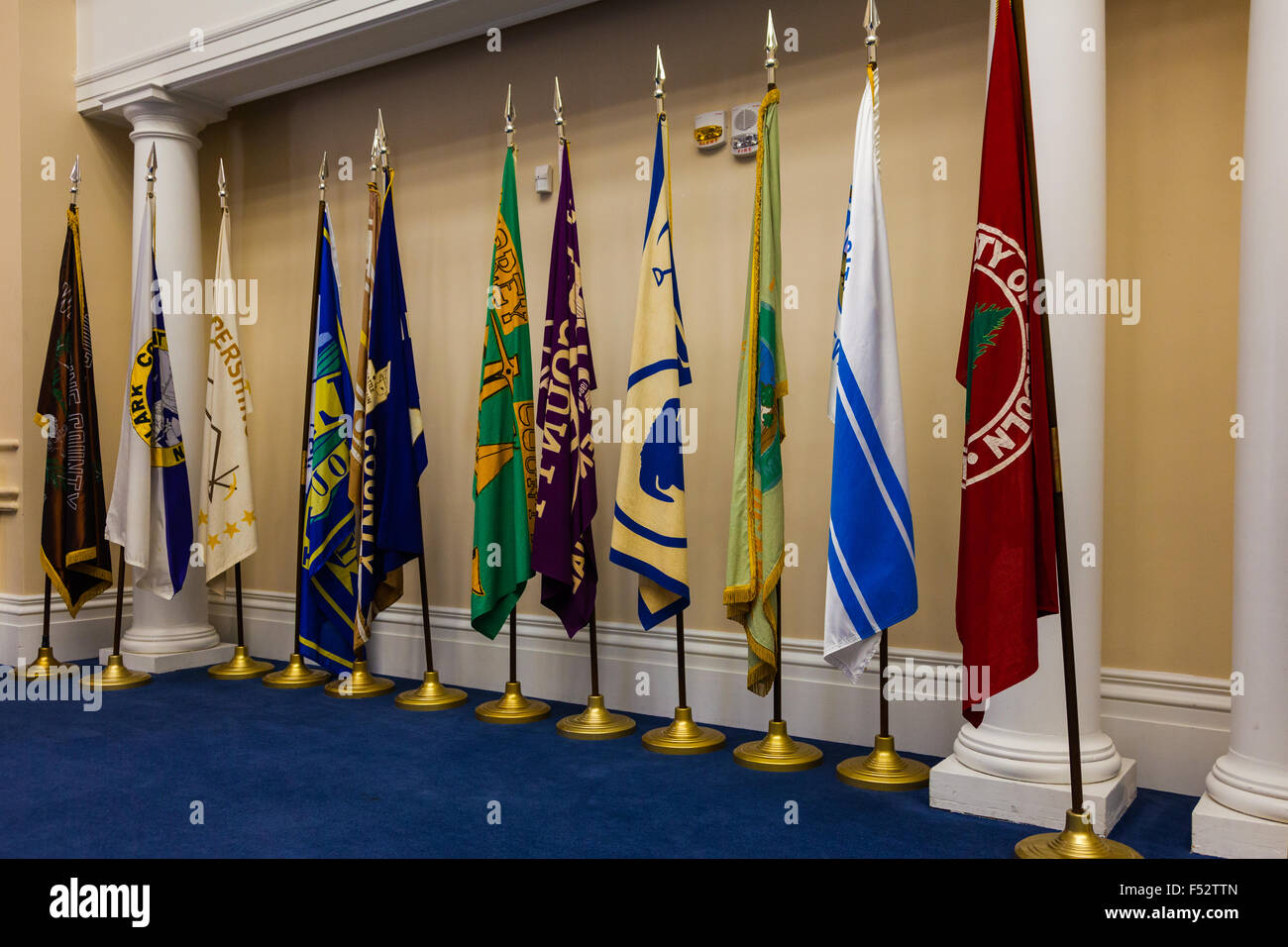 An array of Nevada county flags in the Nevada State Capitol Building in ...
