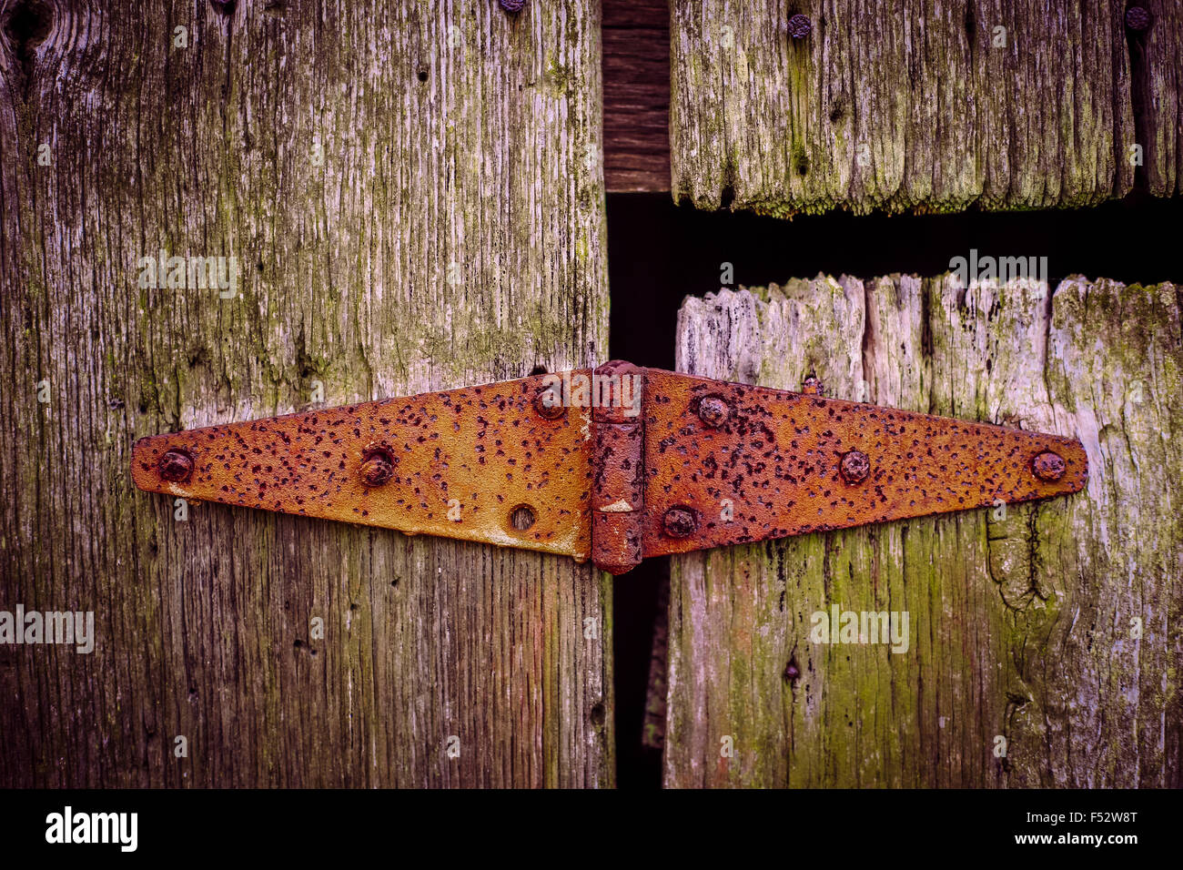 old rusty hinge on the door of an old barn Stock Photo - Alamy