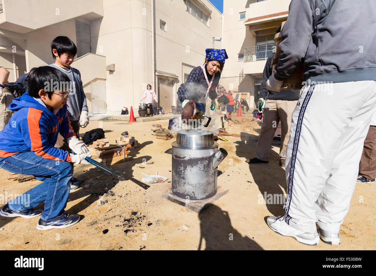 Boy pouring water on woman hi-res stock photography and images - Alamy