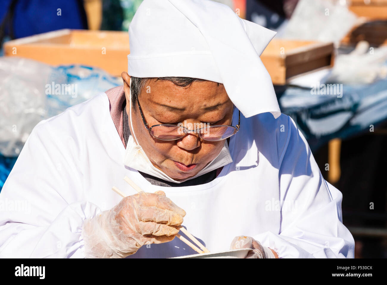 Japan. Omochi, rice bashing festival. Senior large Japanese woman ...