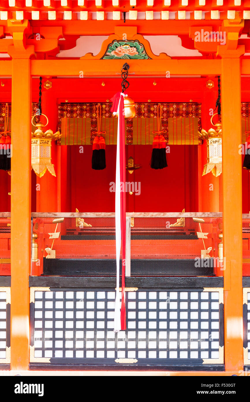 Kyoto, Fushimi Inari Shinto shrine. Front of main vermillion hall, bell ...