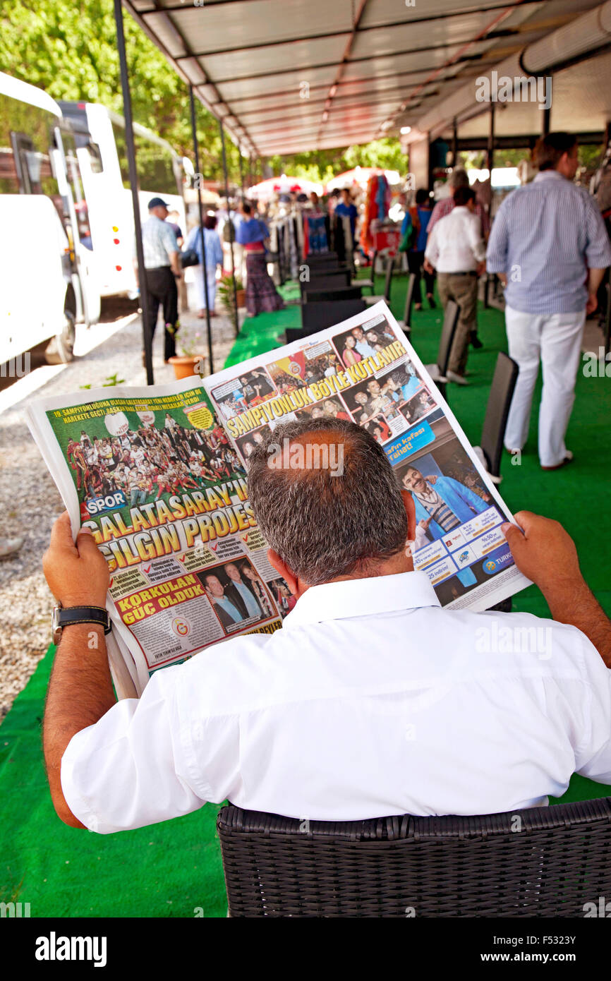 Turkey, Lykien, man, reading newspaper, from behind Stock Photo - Alamy