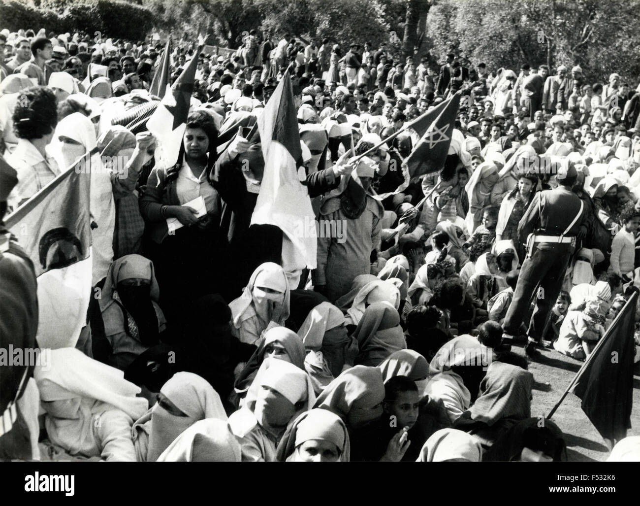 Crowd cheering the King Hassan II for the commemoration of the Algerian ...
